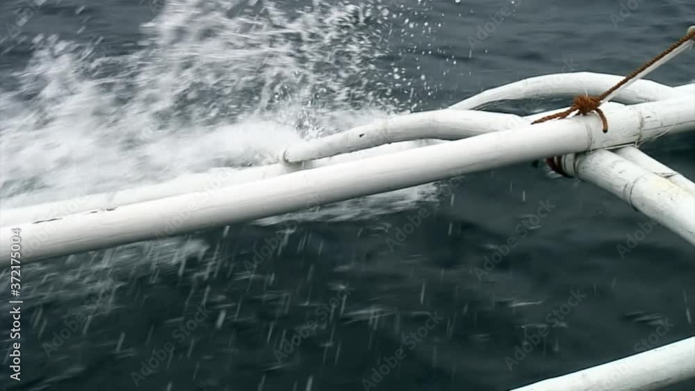 Bamboo wings of philippine boat in sea is construction to strengthen ...
