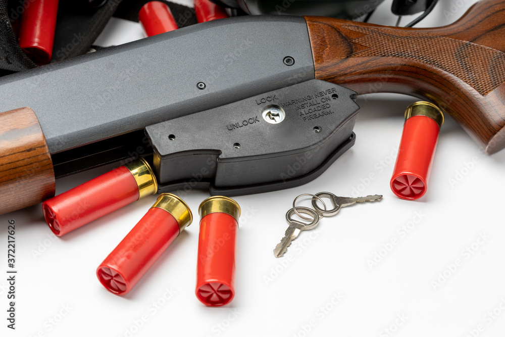 Pump action Shotgun and gun safety trigger locked on white background ...
