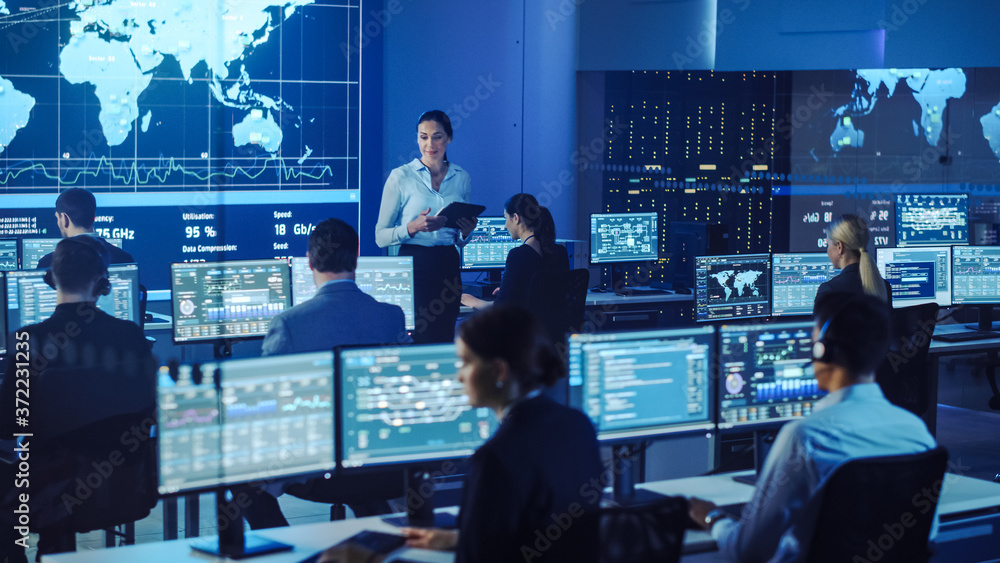 Team of Professional Computer Data Science Engineers Work on Desktops ...