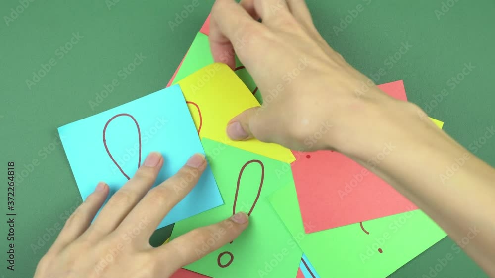 a note with exclamation marks and question marks. Sticky note with ...