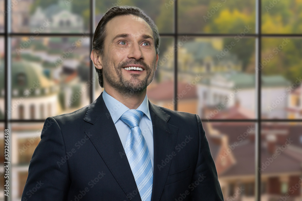 Happy smiling businessman with thoughtful expression. Business person ...