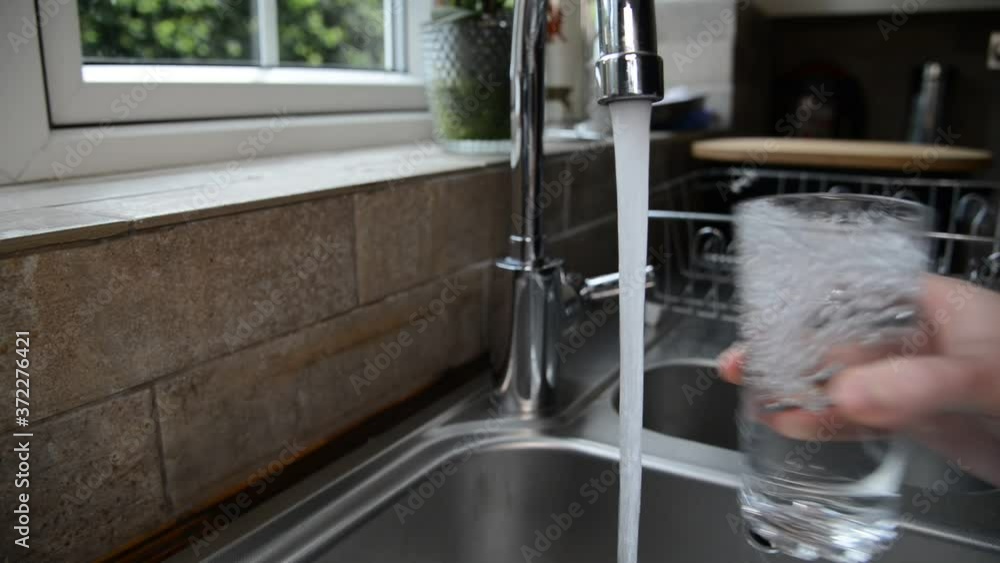 Drinking water out of the tap in the UK Stock Video | Adobe Stock