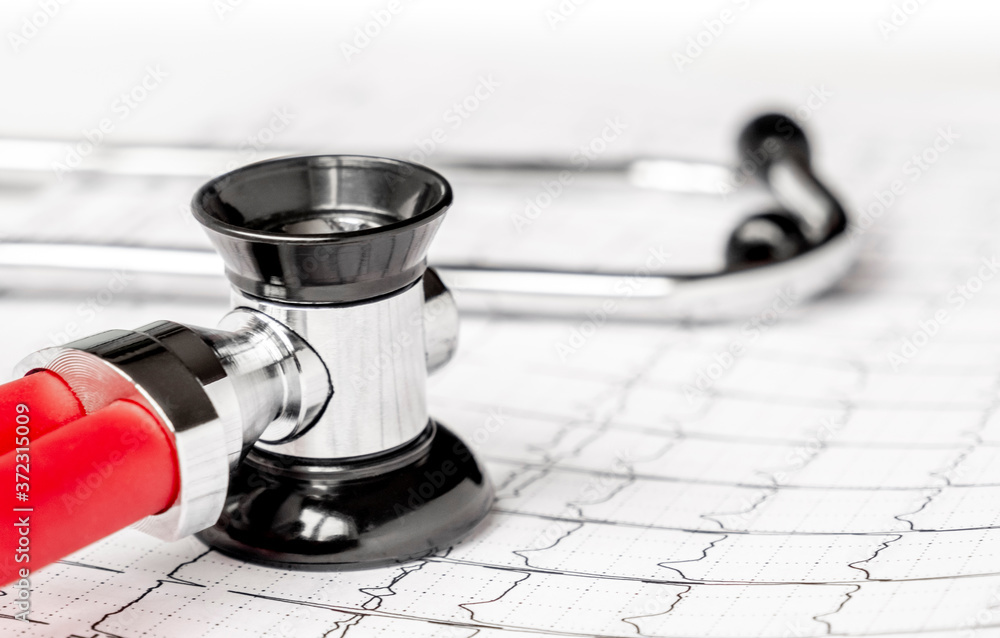Photo of an electrocardiogram ECG or EKG printout with stethoscope ...
