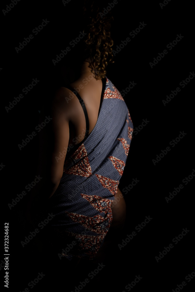 Low-key boudoir photo of a young beautiful Black African woman Stock ...