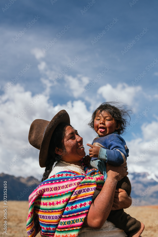 Indigenous mom holding her son Stock Photo | Adobe Stock