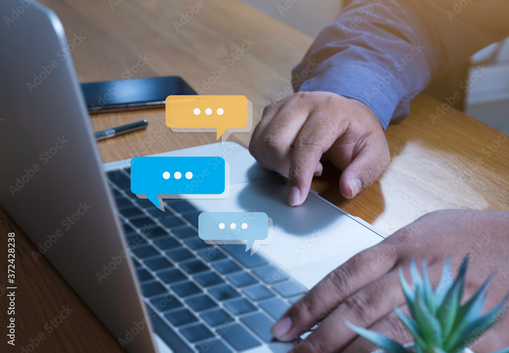 Person hand using computer laptop typing into chat, chatting ...