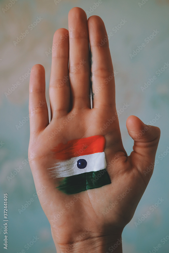 Indian flag painted on the hand. India Independence Day concept. Indian ...