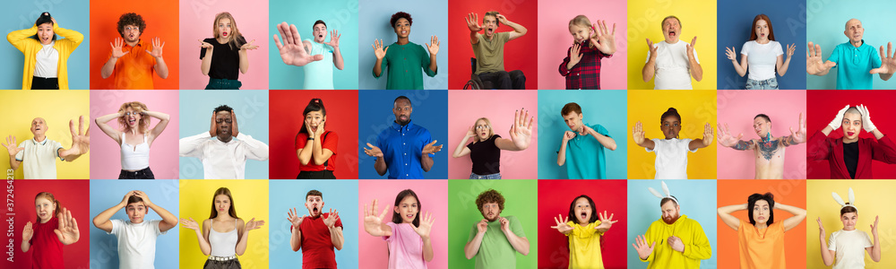Collage of portraits of 26 young emotional people on multicolored ...