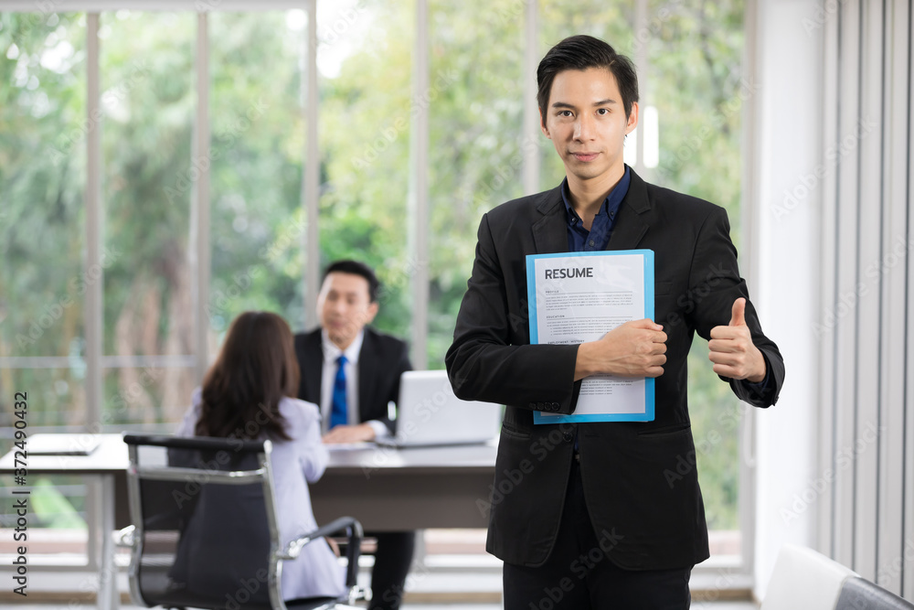 asian businessman holding resume for applying for a job Stock Photo ...