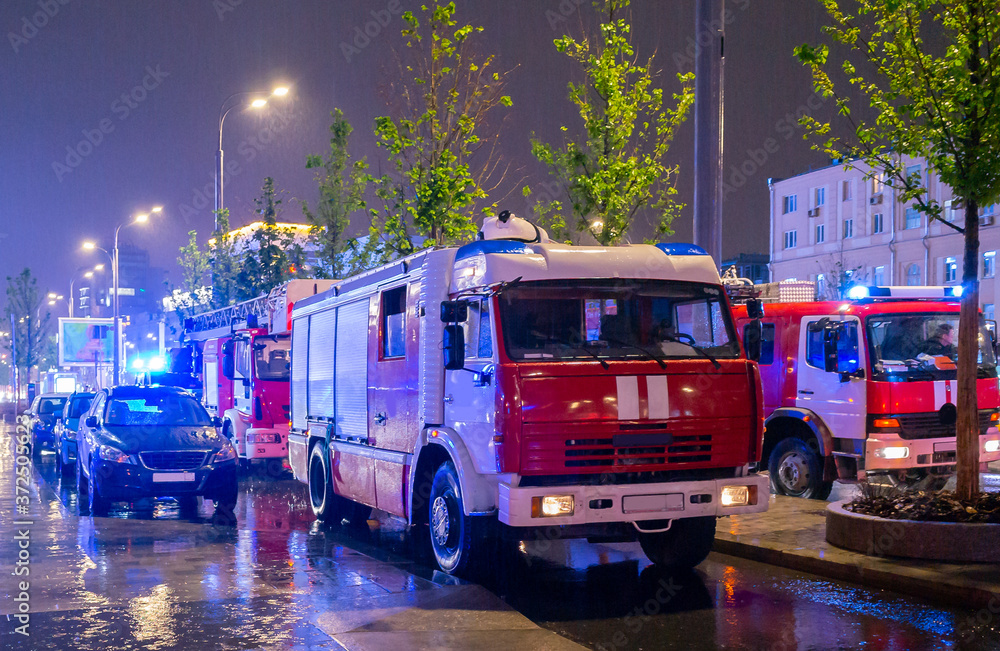 Fire engines in the courtyard of the apartment building where the fire ...
