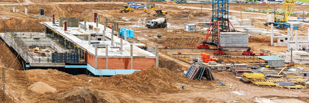 building site with built first storey and machines on ground Stock ...