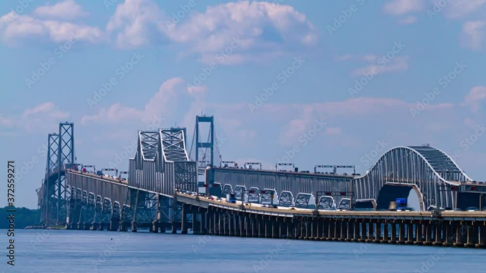 A day time telephoto time lapse footage showing the rush hour traffic ...