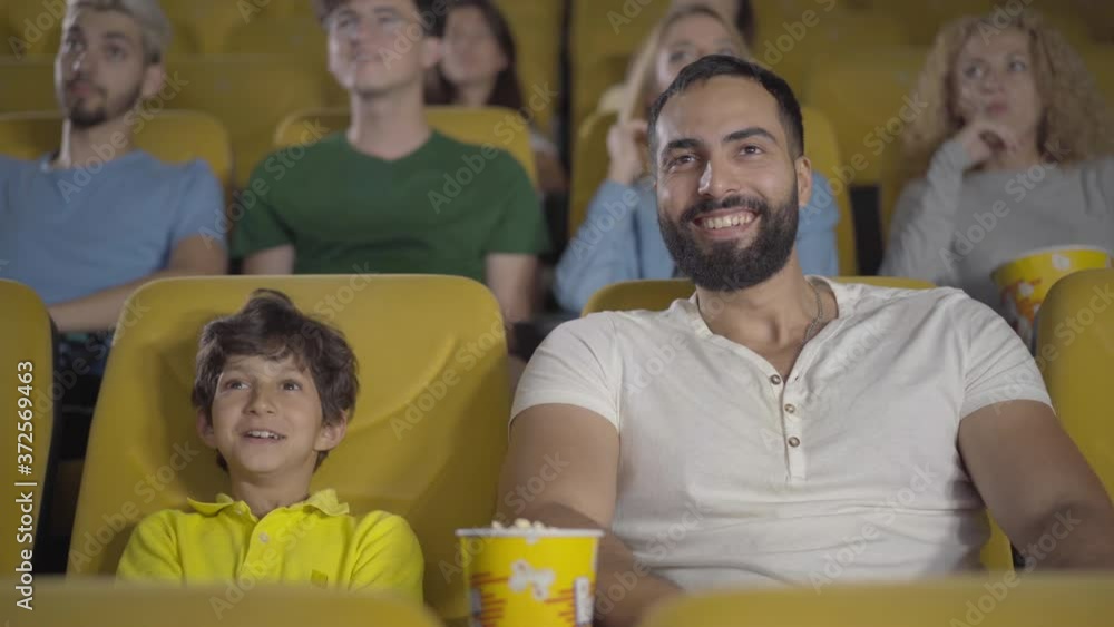 Stockvideon Portrait of Middle Eastern father closing son's eyes ...