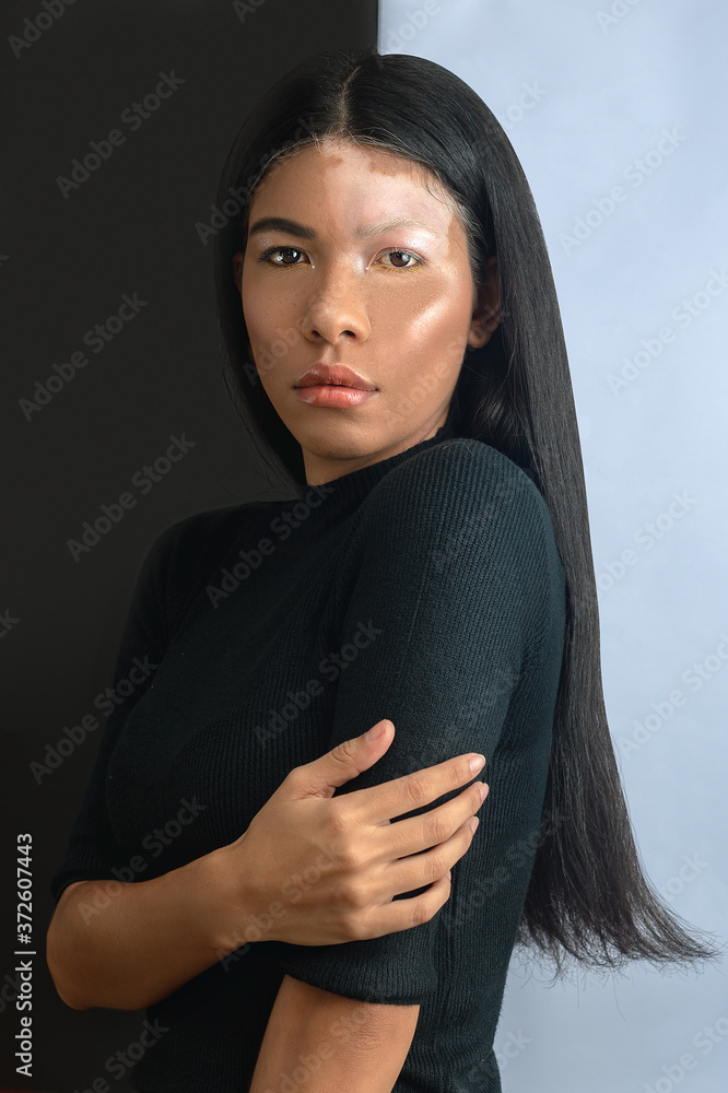 Side view of young sensual emotionless ethnic female with dark hair and ...