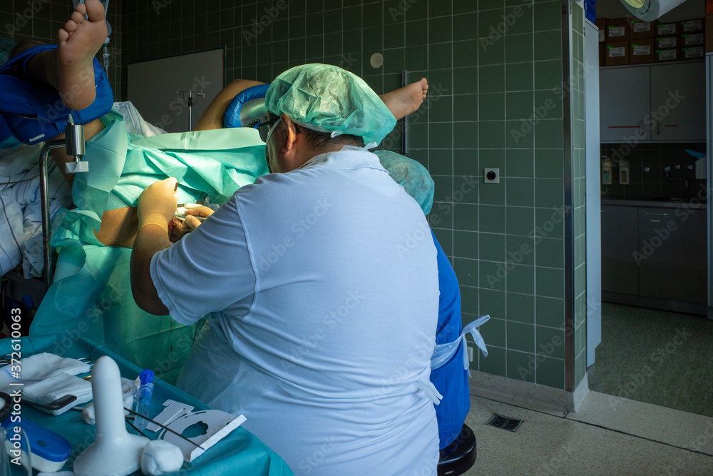 2 doctors perform a proctological procedure on one patient Stock Photo ...