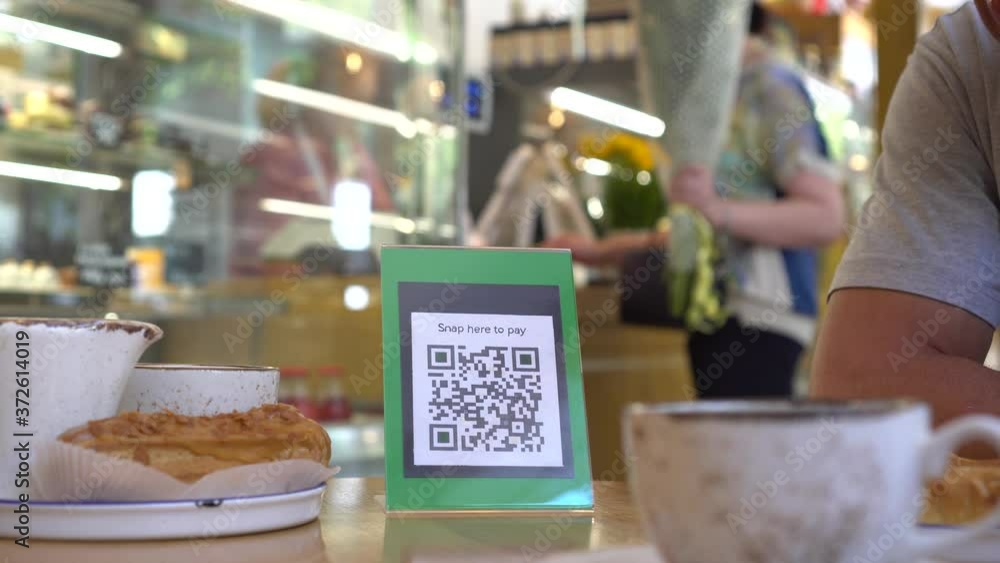 Display with QR code in the store. QR code payment is a contactless ...
