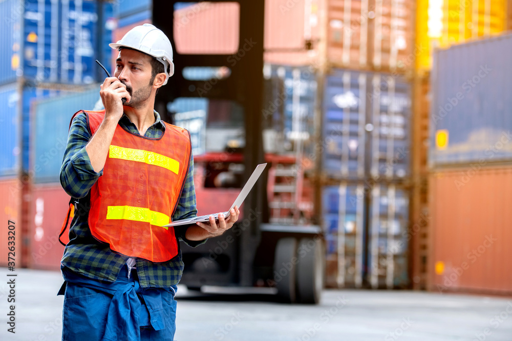Industrial worker working at cargo freight logistic warehouse for ...