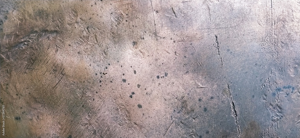 Bronze metal surface. Uneven metal texture with scratches, gouges and ...