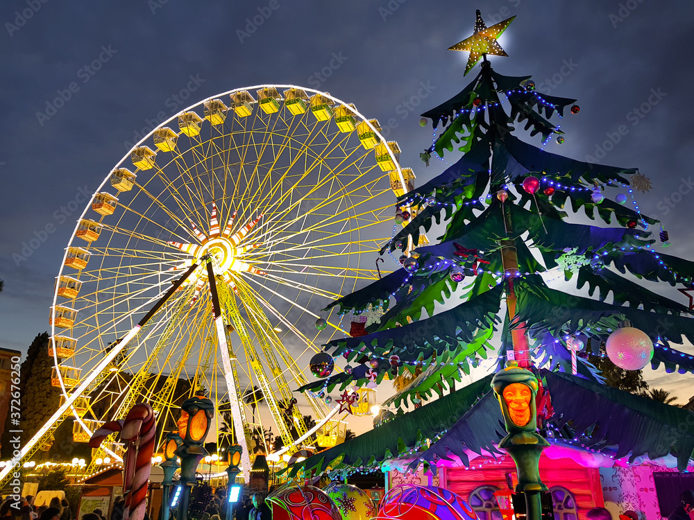 Funfair Christmas market -Ferris wheel & tree Stock Photo | Adobe Stock