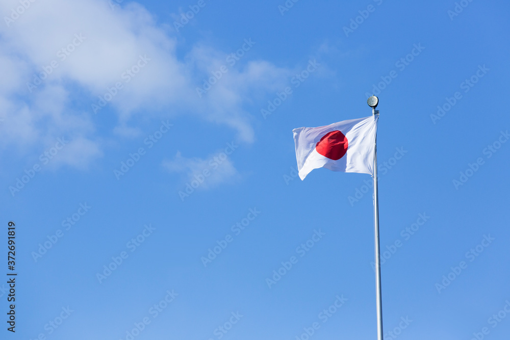 風にたなびく日本国旗 Stock Photo | Adobe Stock