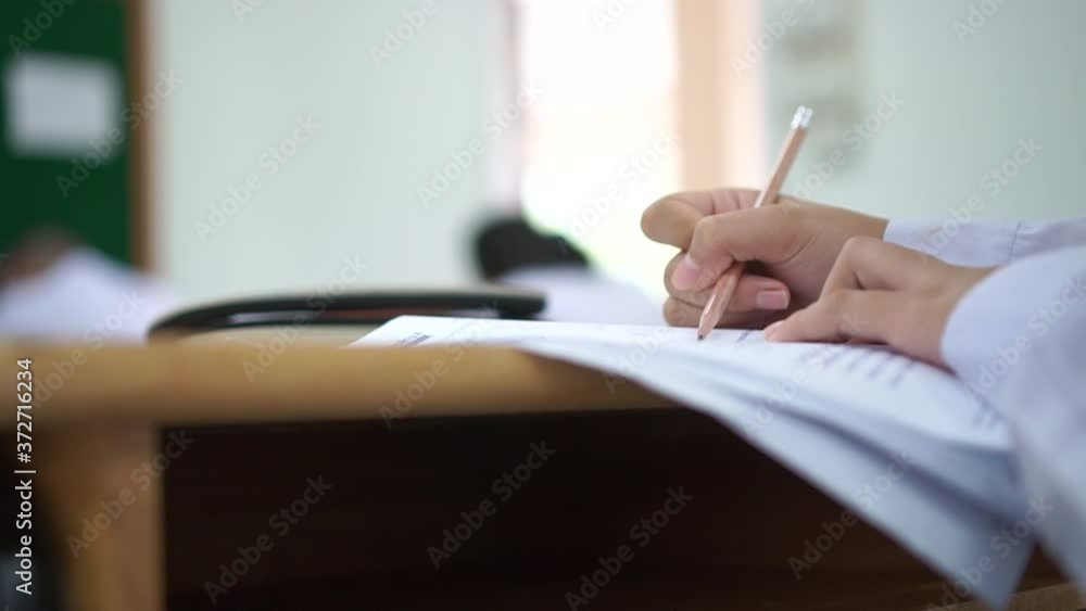 Student hand testing doing test exam with pencil drawing selected ...
