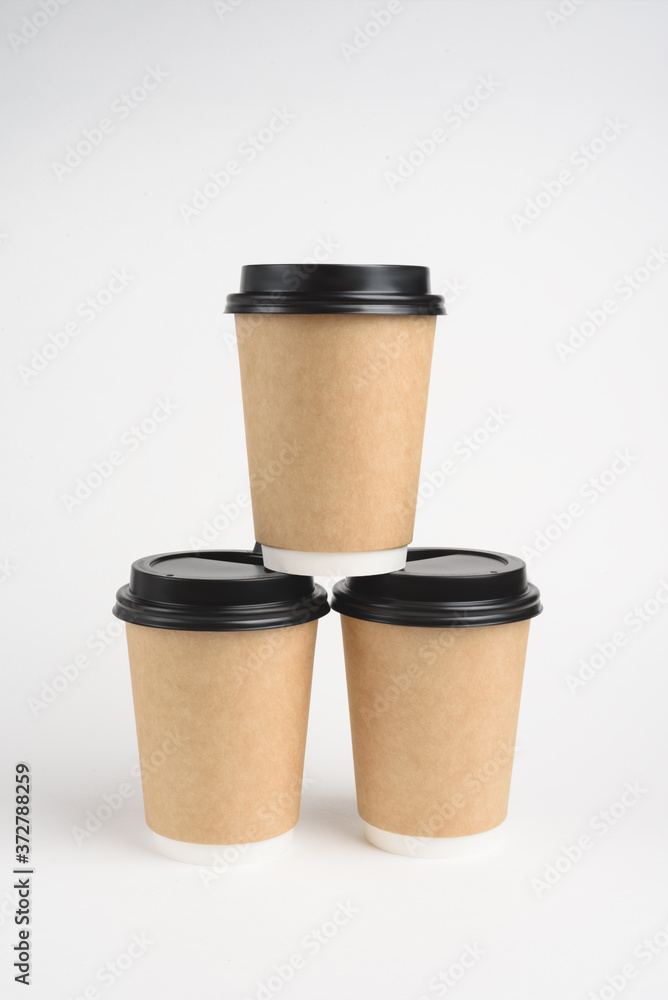 Three eco friendly paper craft cups for coffee to go with black lid on ...
