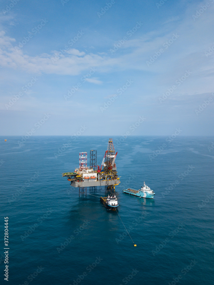 Aerial view offshore jack up rig at the offshore location during sunset ...