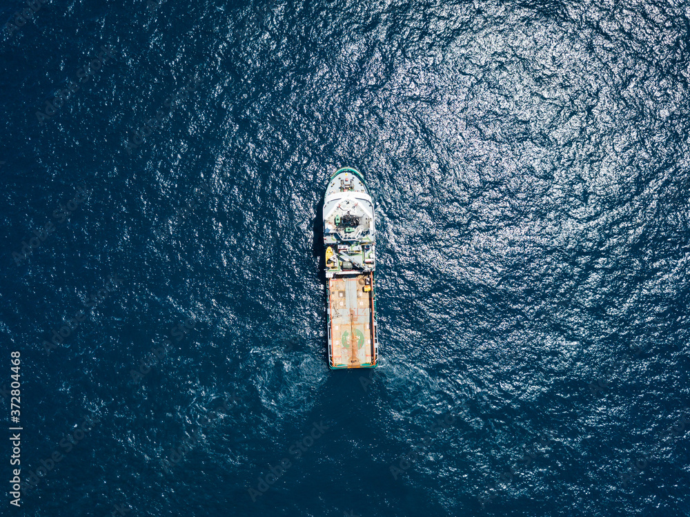Aerial view offshore supply vessel for towing a jack up rig at the ...