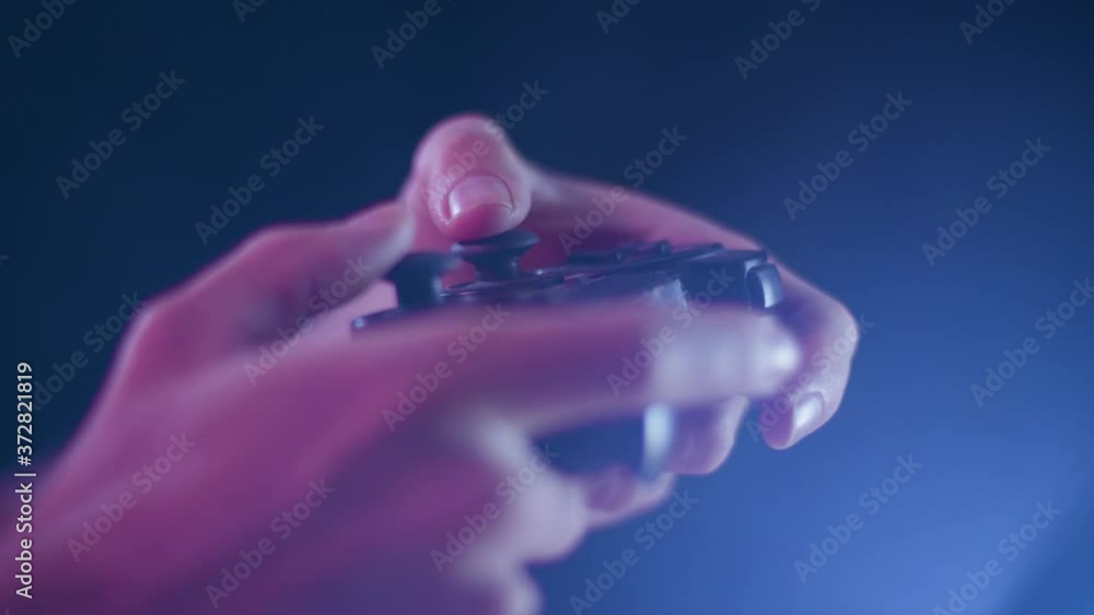 Playing video games on a small controller using joysticks playing ...