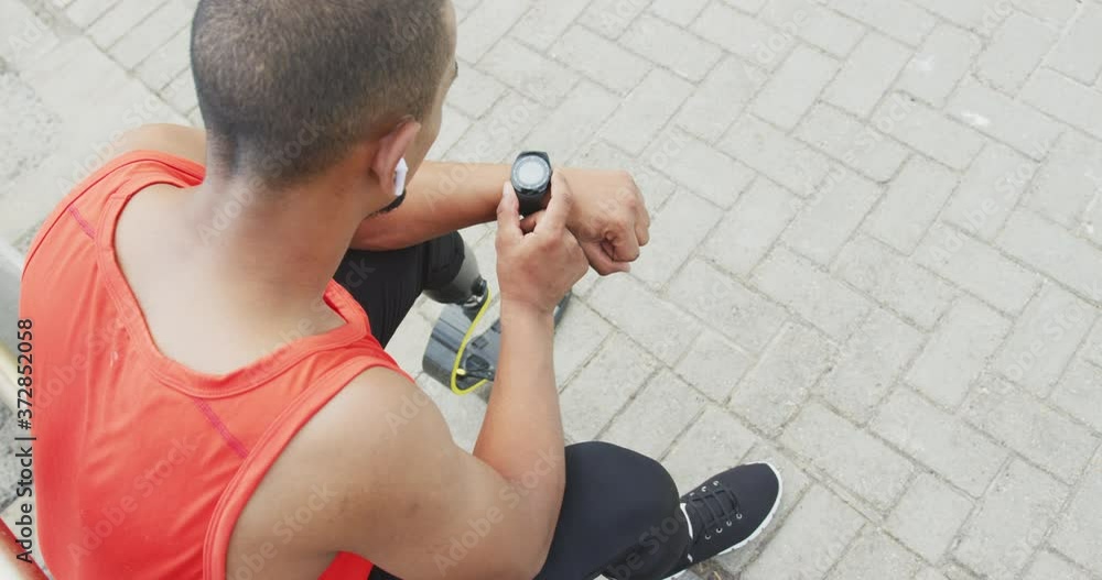 Side view man with prosthetic leg looking at his watch Stock Video ...