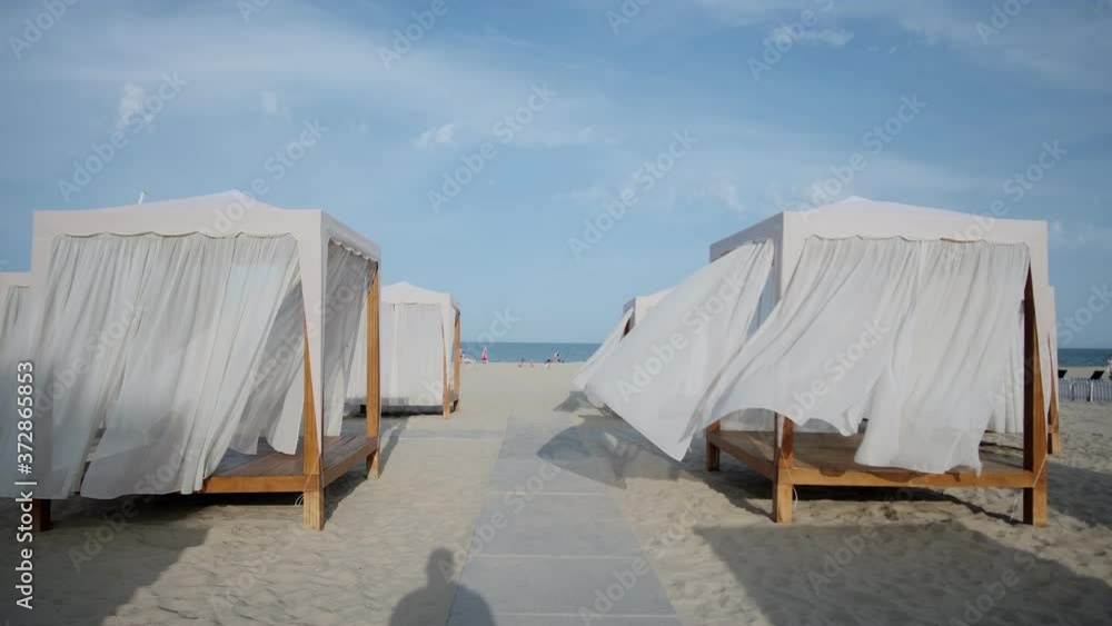 VIP area on the beach. Romantic luxury beach canopy on the beach. sandy ...