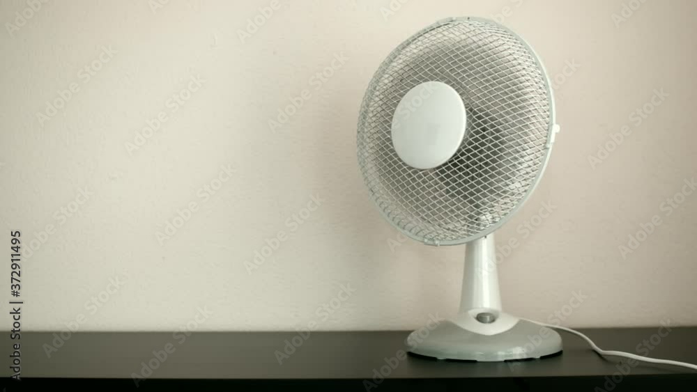 Fan for cooling wind during a hot day in front of a white wall Stock ...