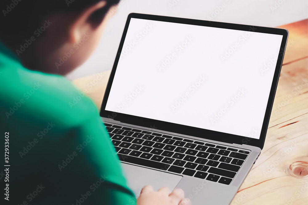 boy using a laptop for doing homework. distance learning online ...