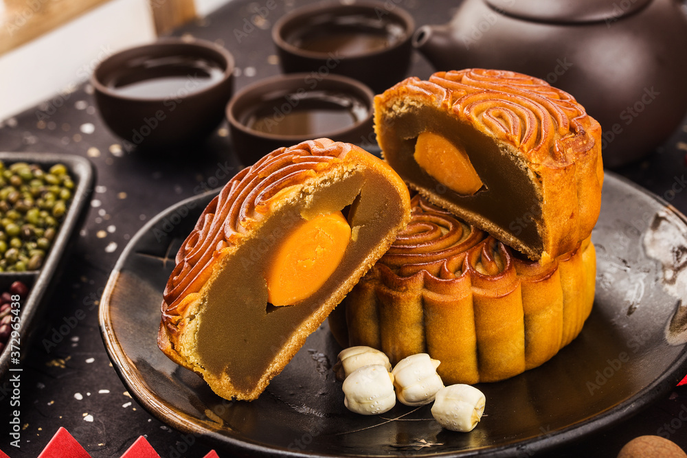 Mid-Autumn Festival concept, Traditional mooncakes on table with teacup ...
