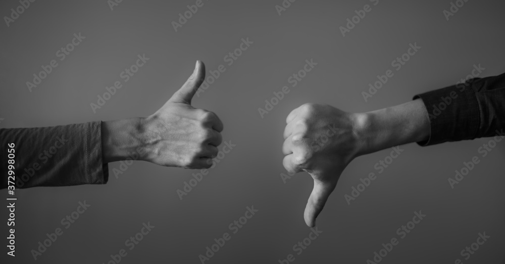 Hand with thumbs up and thumbs down. Yes or no sign. Stock Photo ...