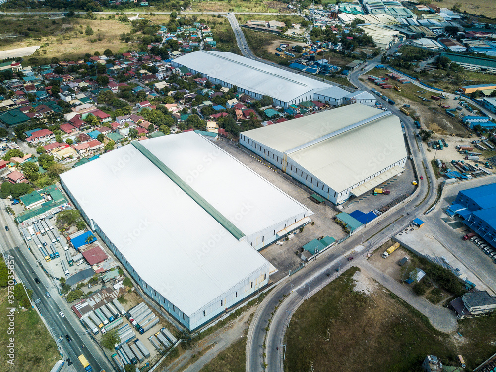 Aerial of large factories with corrugated metal roofing in Bulacan near ...