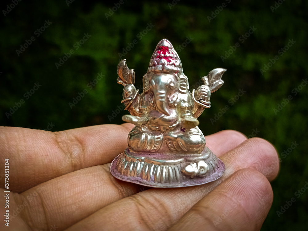 Ganpati Bappa (God) put on hand......... God of hindu religion. Stock ...