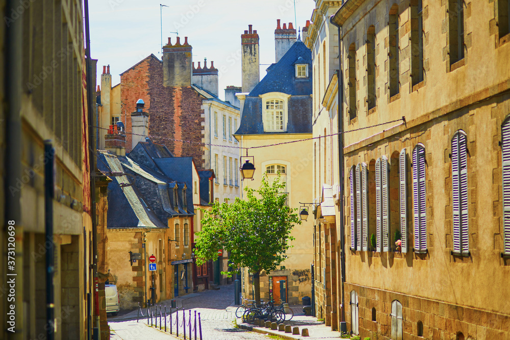 street in medieval town of Rennes, one of the most popular tourist ...