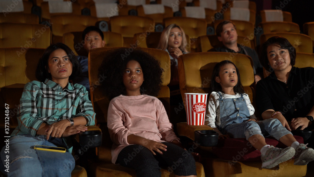 People audience watching movie in the movie theater cinema. Group ...