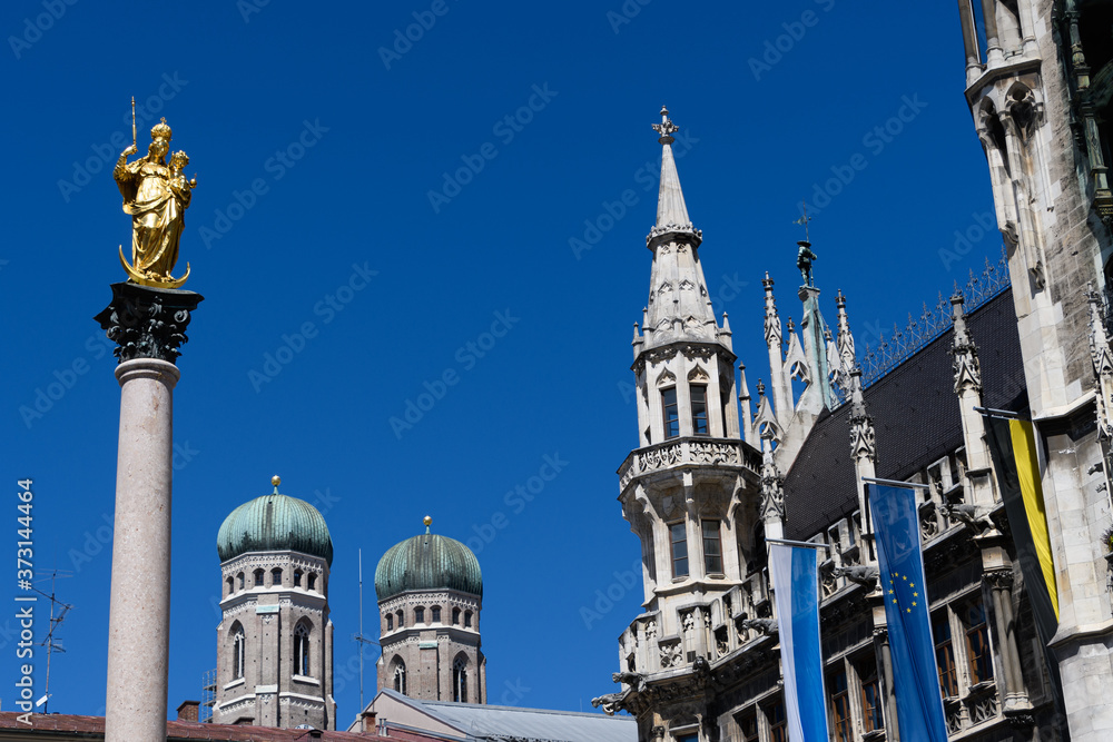 Marienplatz, Munich, Germany; Marienstatue (Statue of Mary), towers of ...