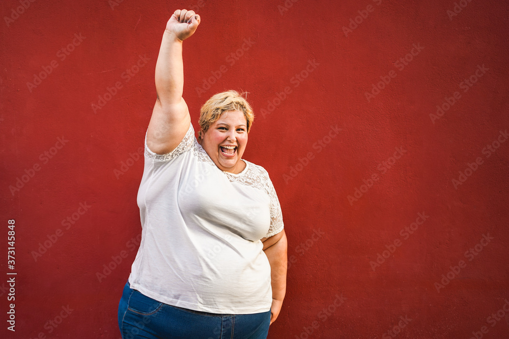 Happy plus-size woman celebrating for female power - Curvy overweight ...