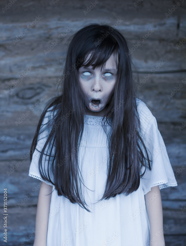 Scary ghost halloween theme. Horror devil girl with white eyes opens ...