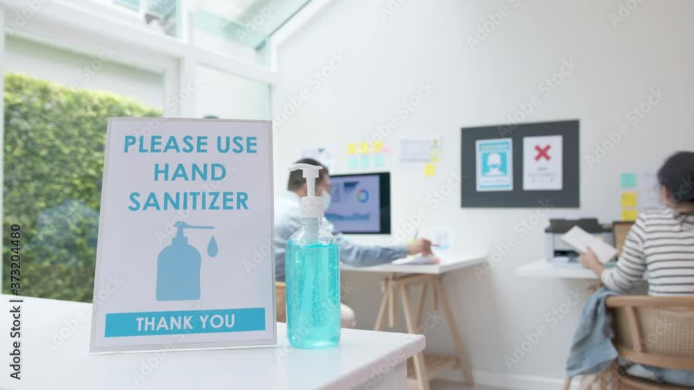 Close up hand sanitizer alcohol gel bottle and please use hand ...