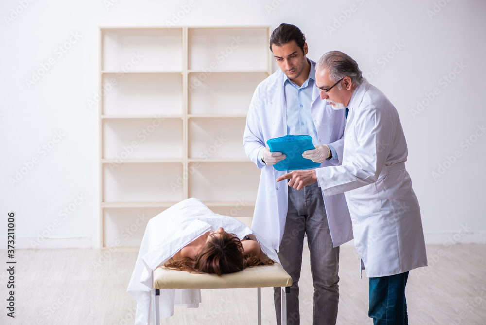 Police coroner examining dead body corpse in morgue Stock Photo | Adobe ...