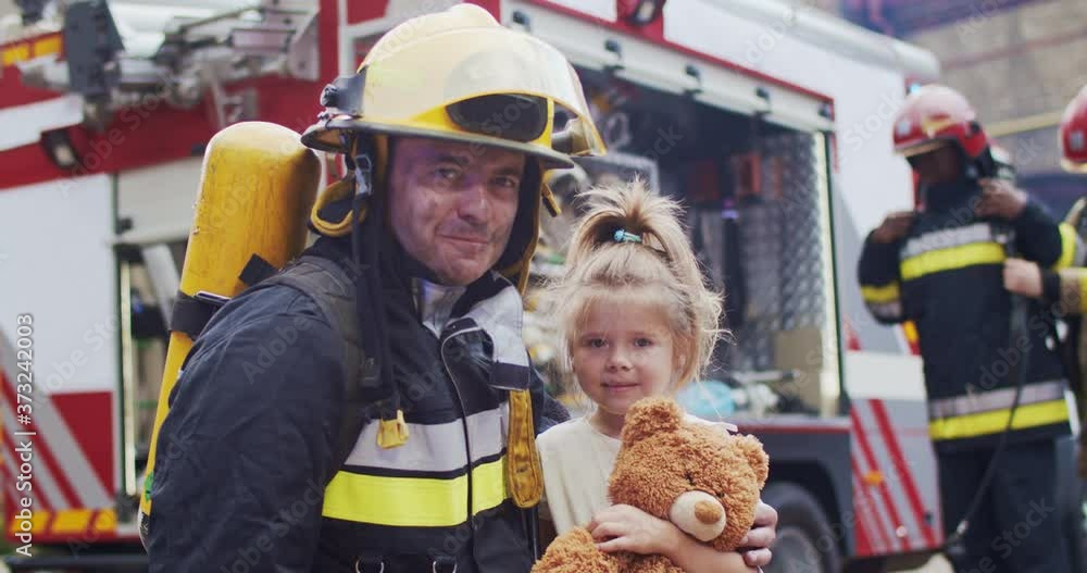 Video „Firefighter hug rescued little girl with teddy bear. Frightened ...
