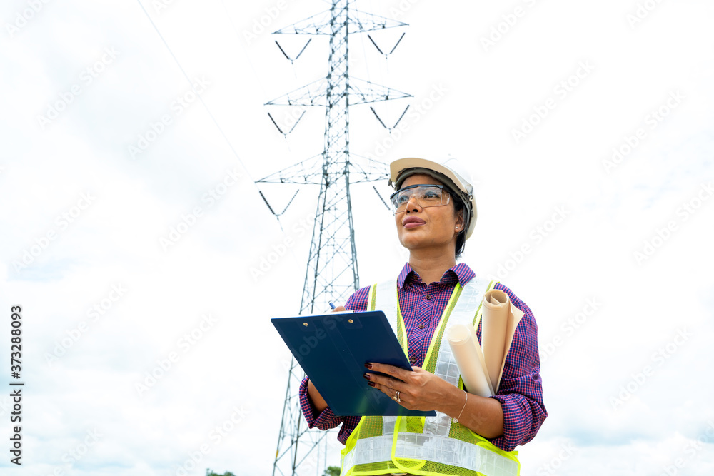Electrical engineer use tablet working check high voltage pole Power ...