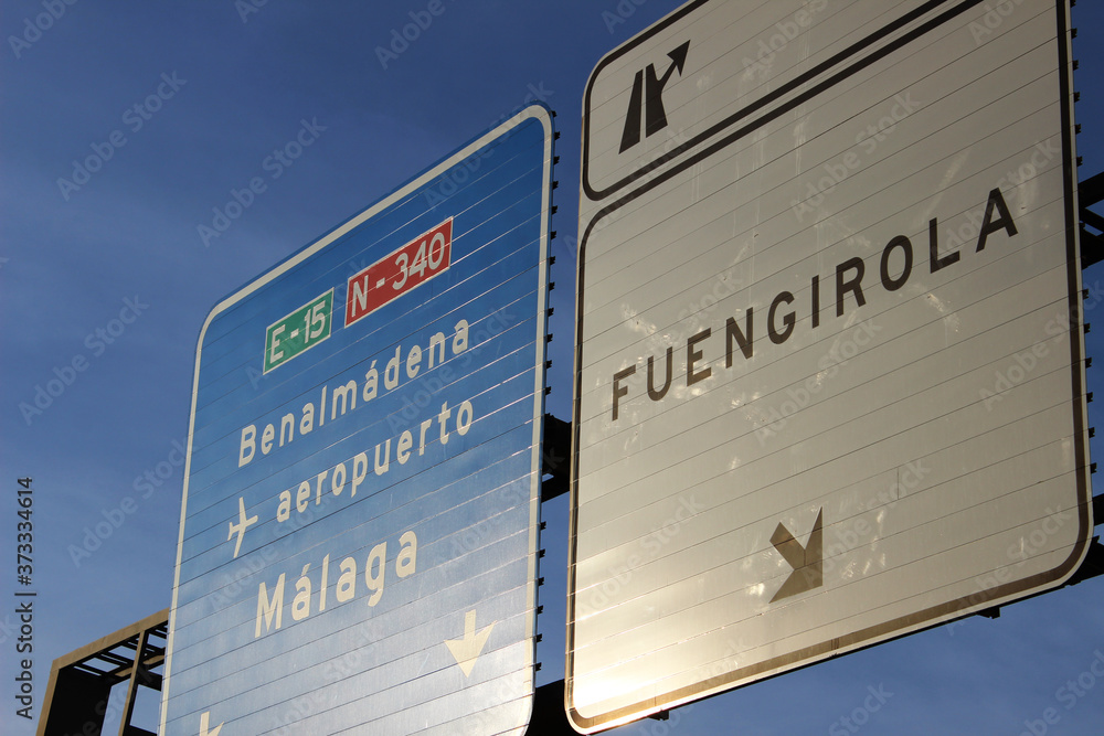 Road sign indicating the cities of Benalmádena and Fuengirola, in the ...