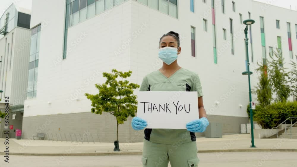 Indian ethnicity woman, POC, nurse doctor wearing PPE uniform, gloves ...