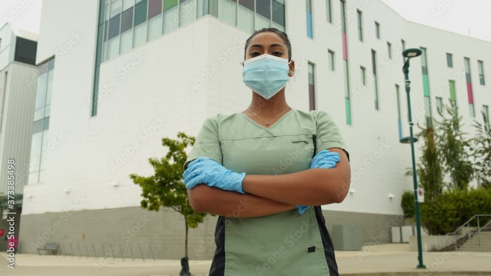 Indian woman, POC, nurse doctor wearing PPE uniform, mask, gloves ...