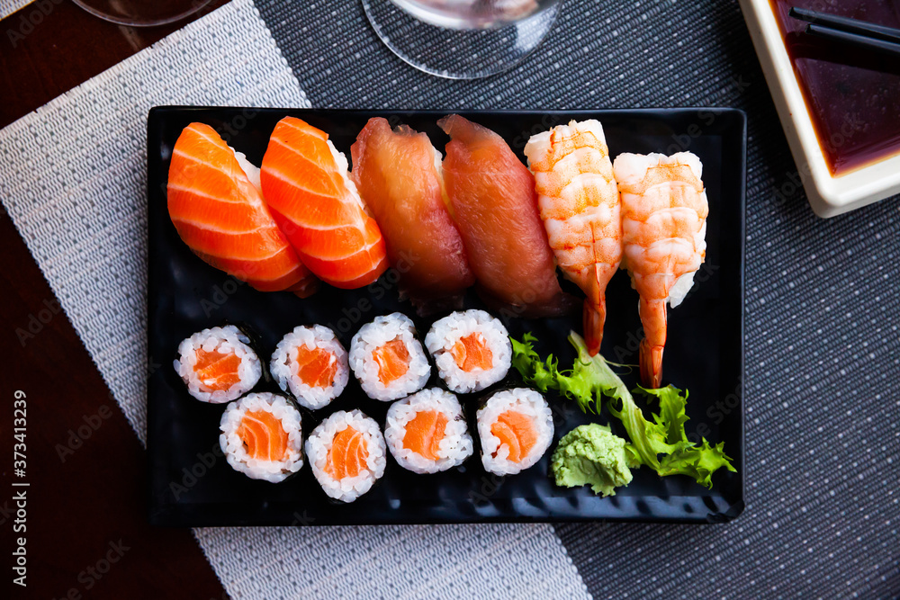 Combined sushi - maki salmon, nigiri variado closeup. Japanese cuisine ...